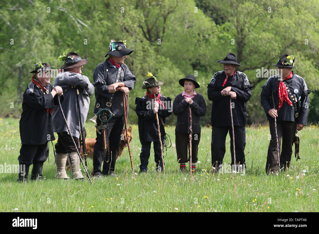 Tanne, Germany. 26th May, 2019. Cow herders stand with their staffs at ...