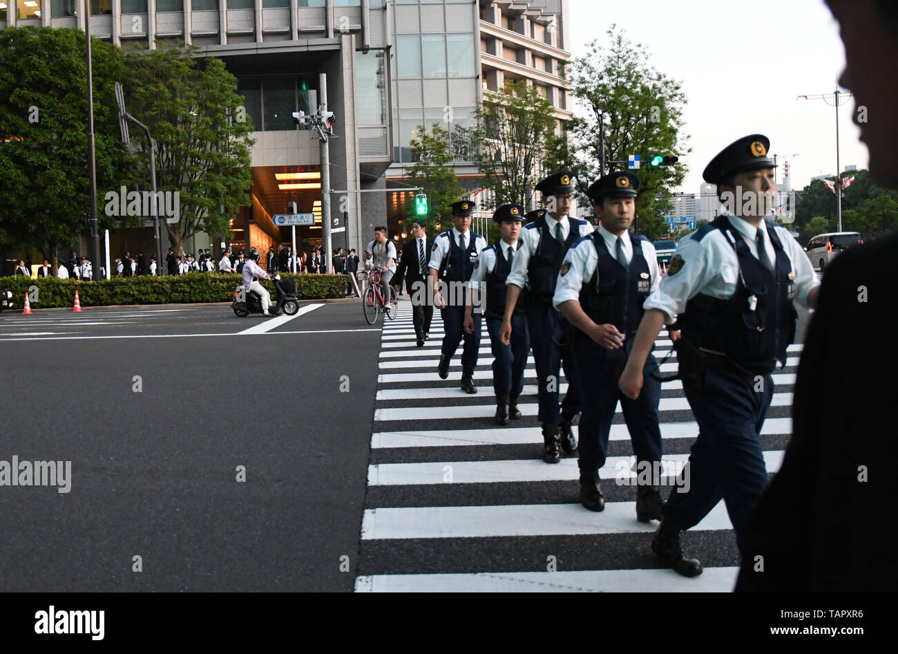 May 25, 2019 - Tokyo, Japan - A group of Tokyo Police officers cross a ...
