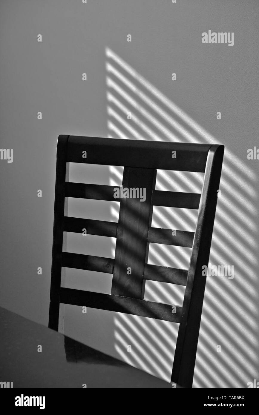 Chair and shadow Stock Photo - Alamy