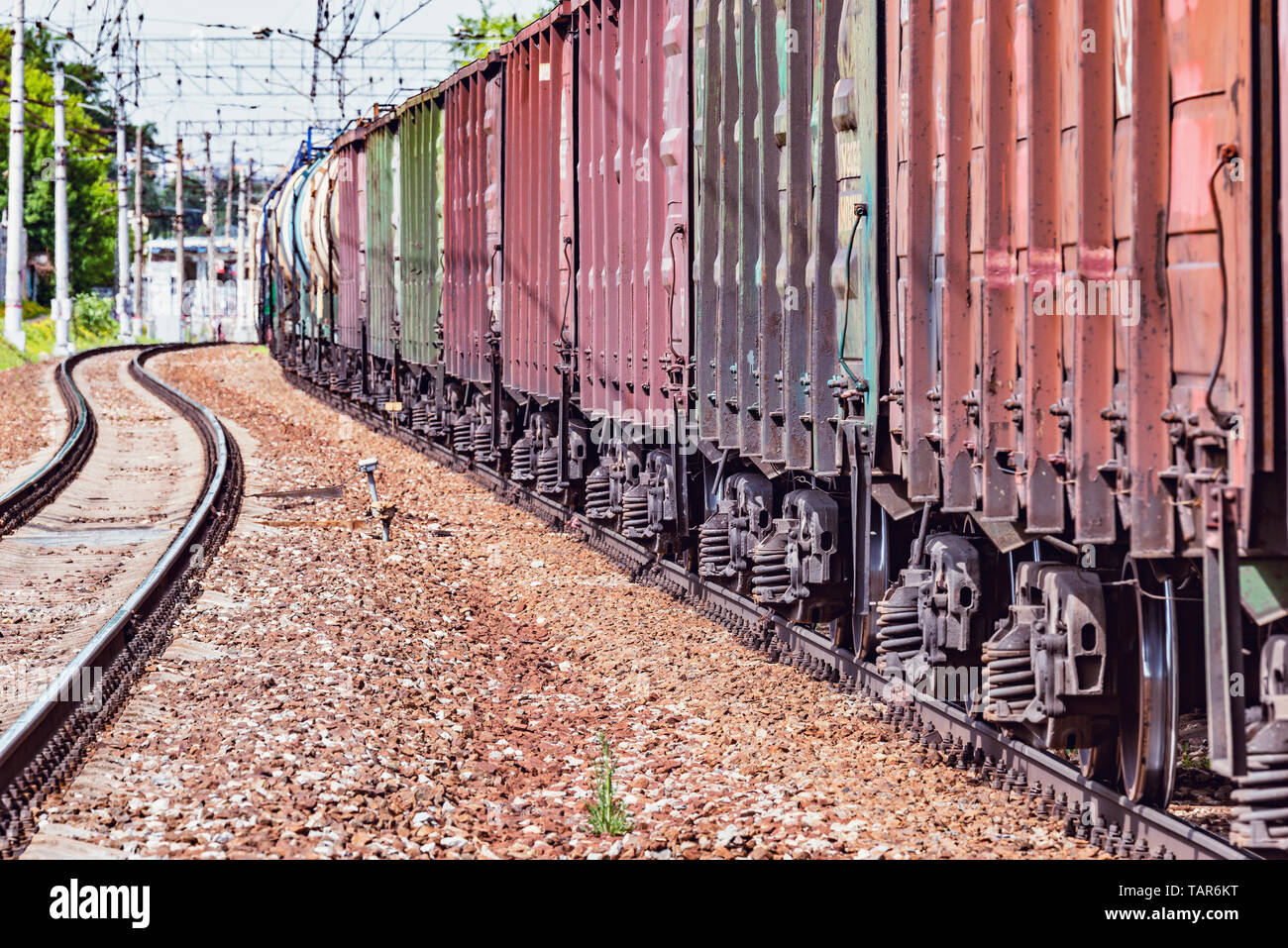 Long freight train approaches to the station Stock Photo - Alamy