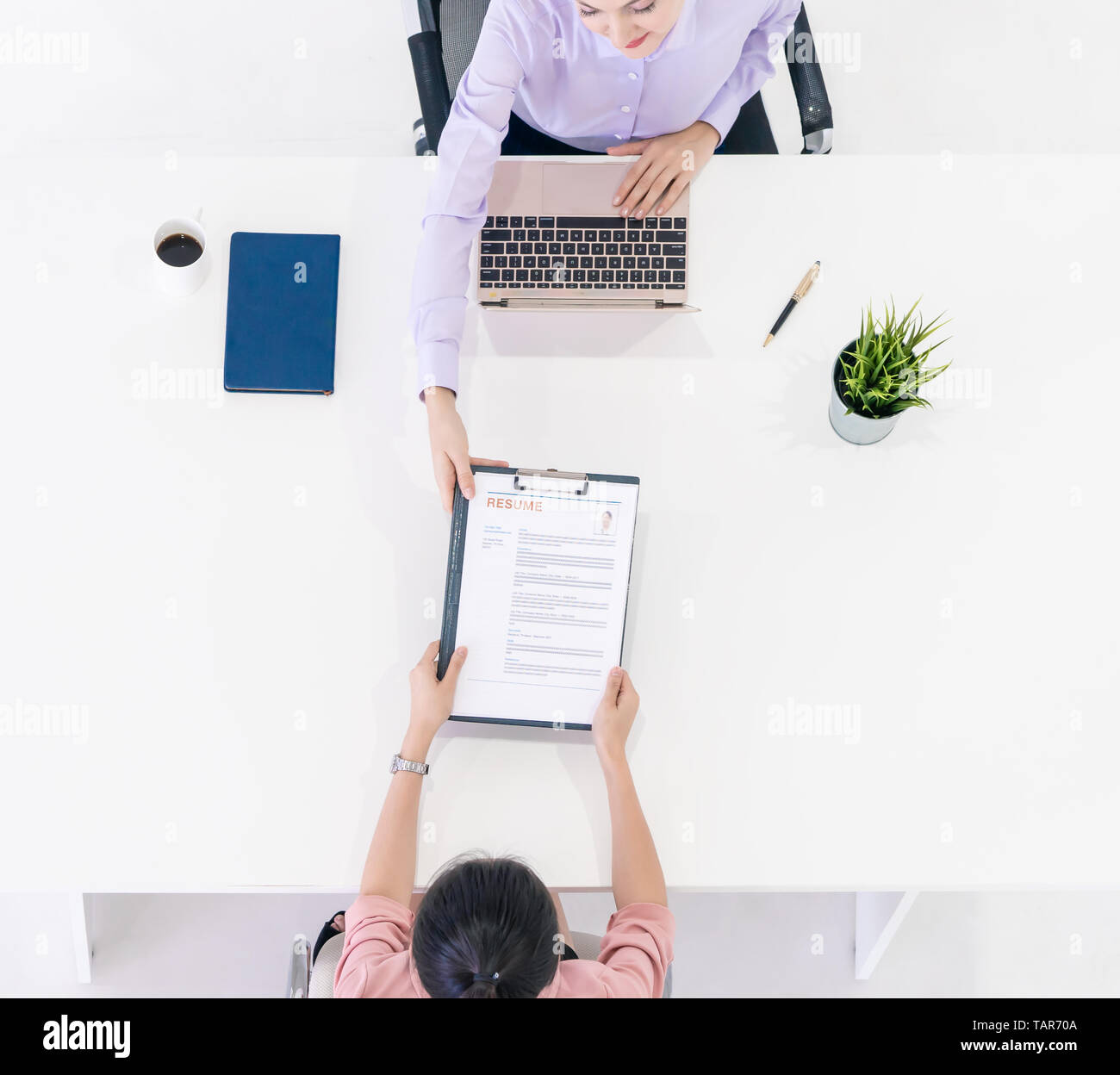 Woman handling the job interview resume to HR Stock Photo - Alamy