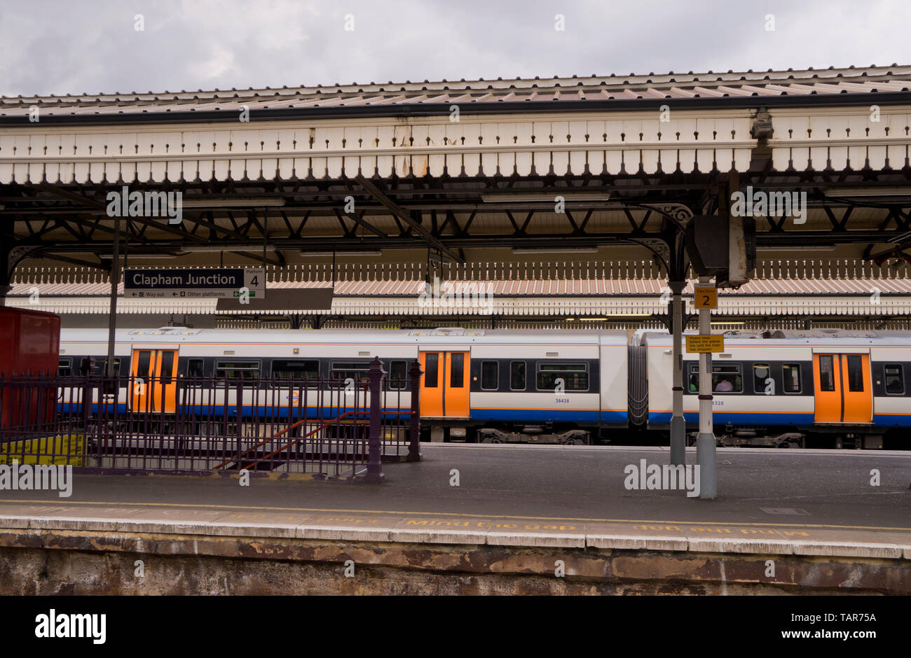 Train waiting at platform at Queenstown Road railway station in ...