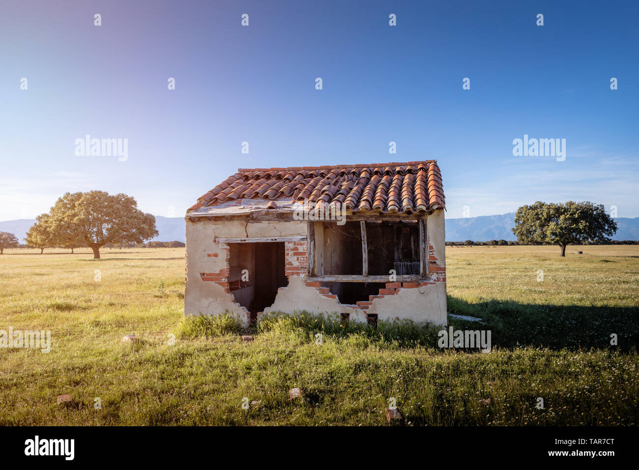 Small old house with the roof collapsed and a broken window Stock Photo ...