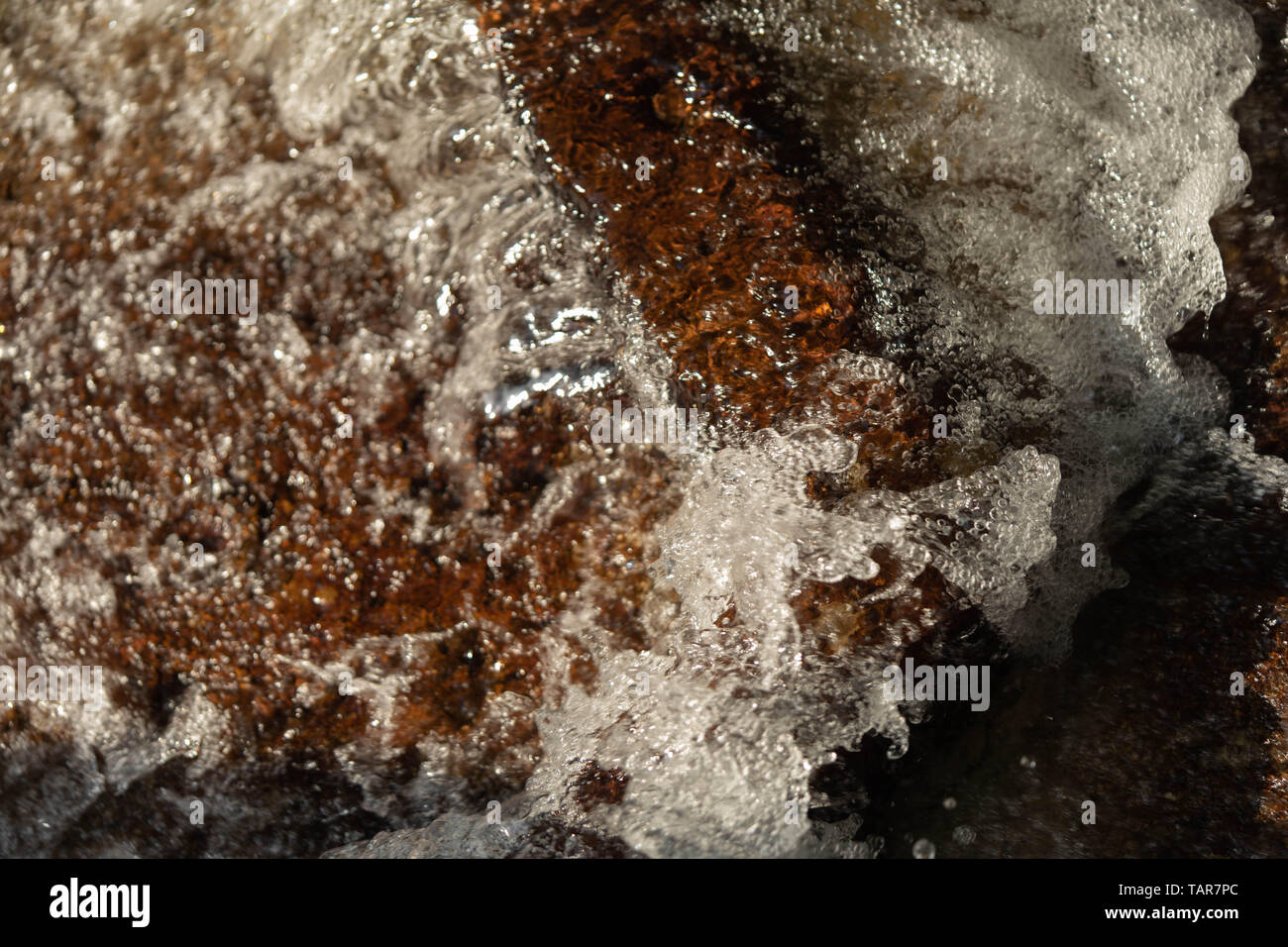 A stream of water, a waterfall formed on a flooded concrete staircase ...