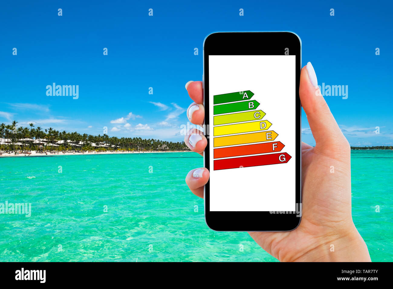 Hand holding digital smartphone with house efficiency rating. Detail of ...