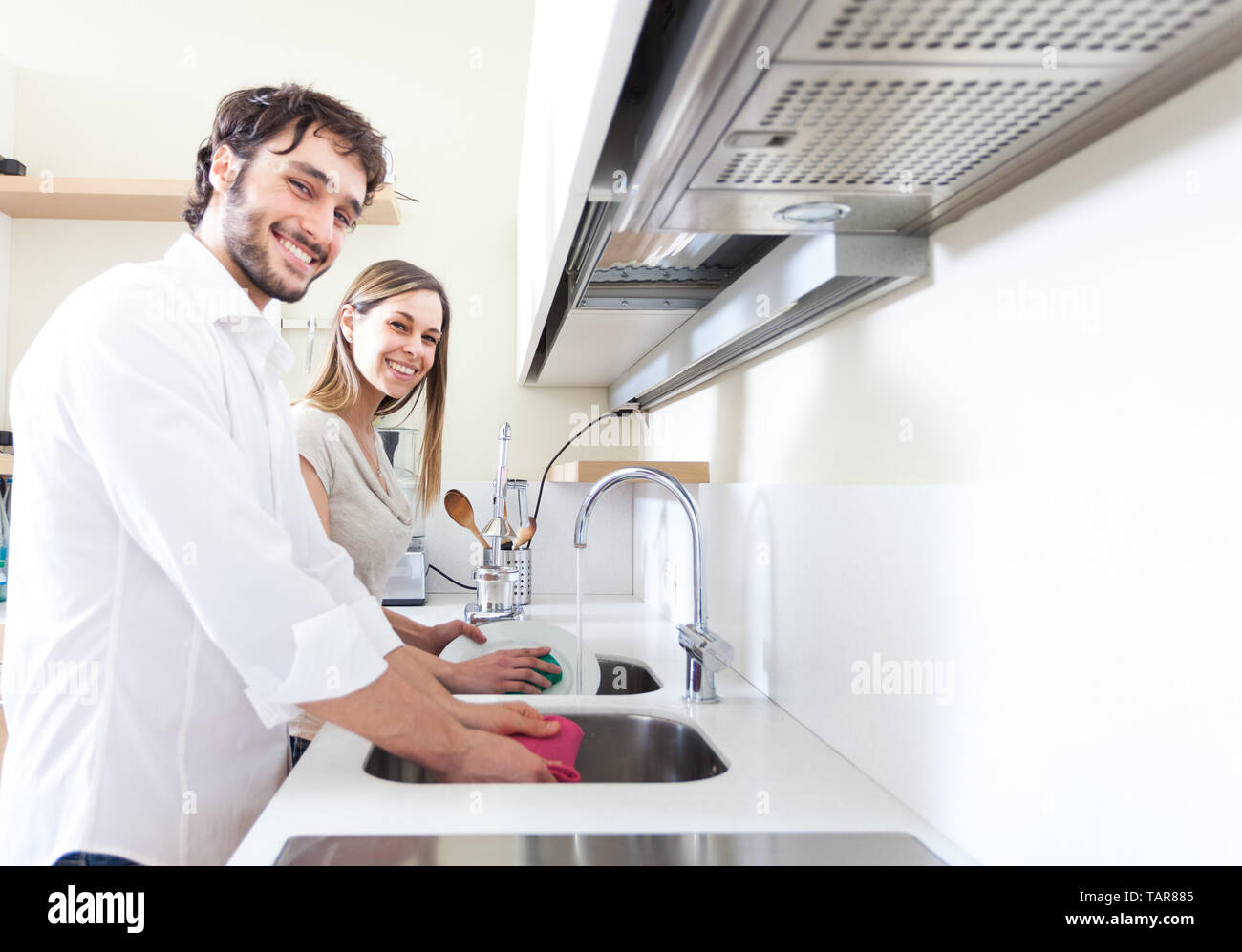 Doing dishes hi-res stock photography and images - Alamy