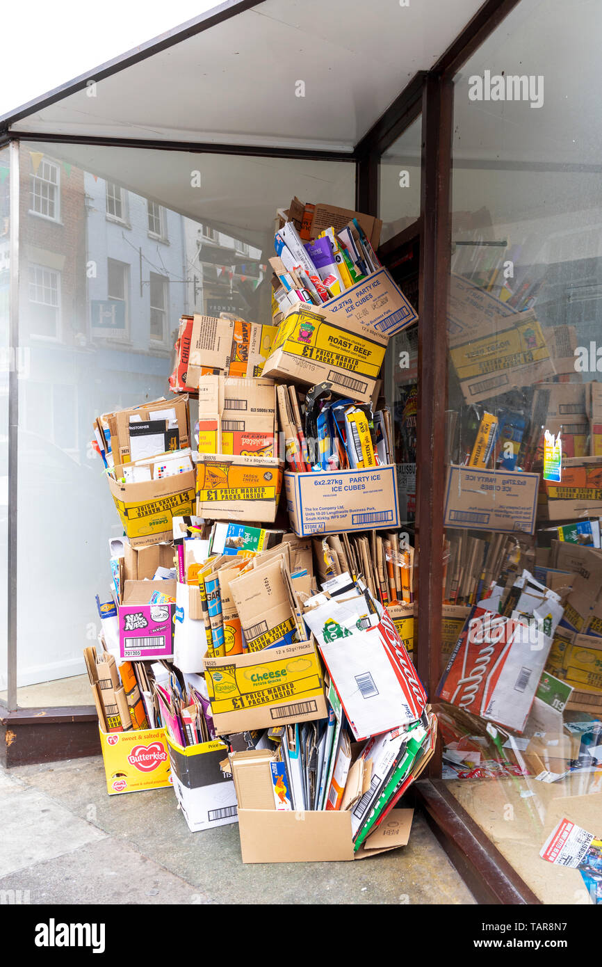 Stacks fo empty and folded cardboard boxes awaiting collection for ...