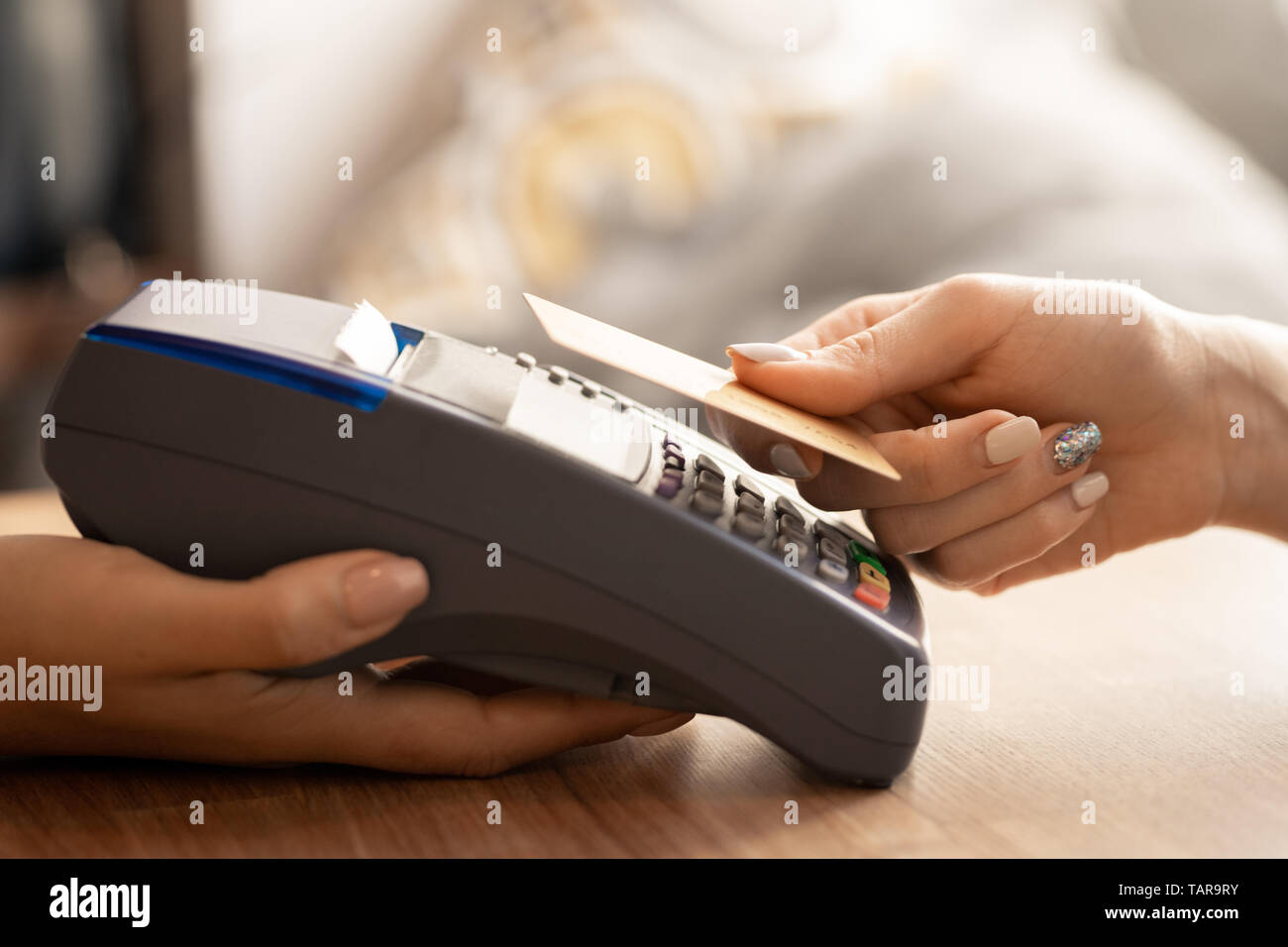Paying by card Stock Photo - Alamy