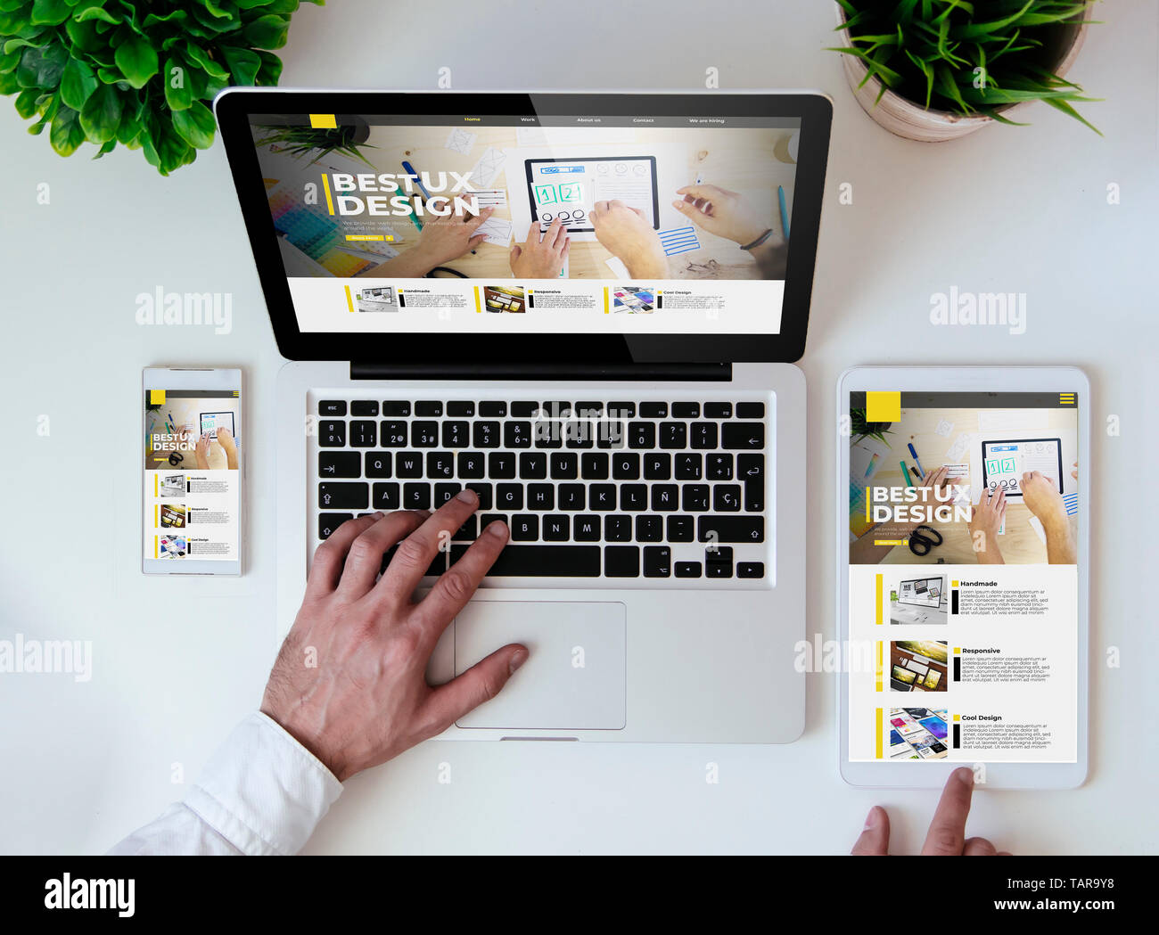 office tabletop with tablet, smartphone and laptop showing responsive ...