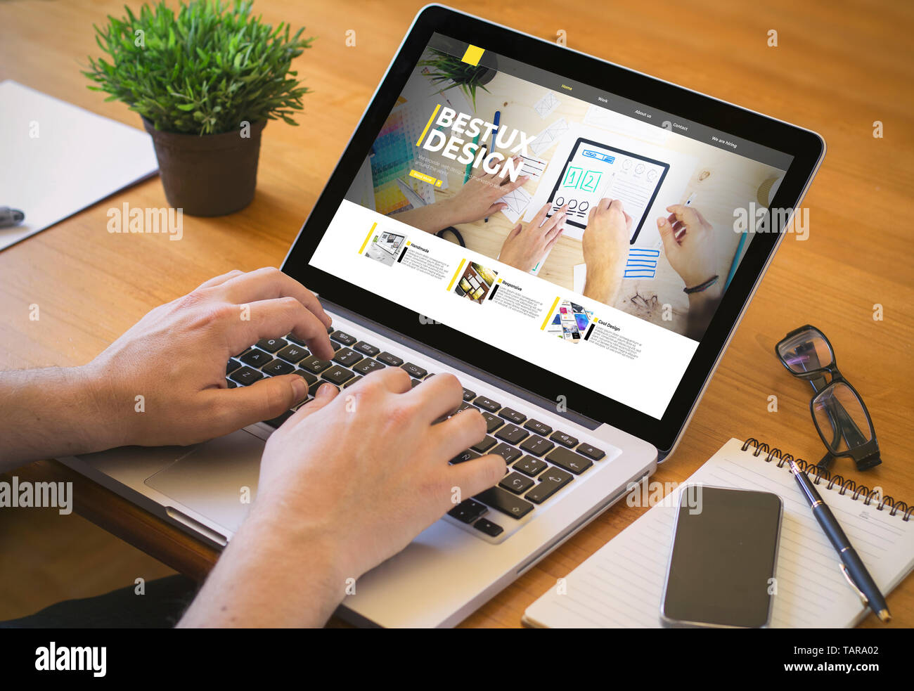 ux design concept. Close-up top view of a man working on laptop. all ...