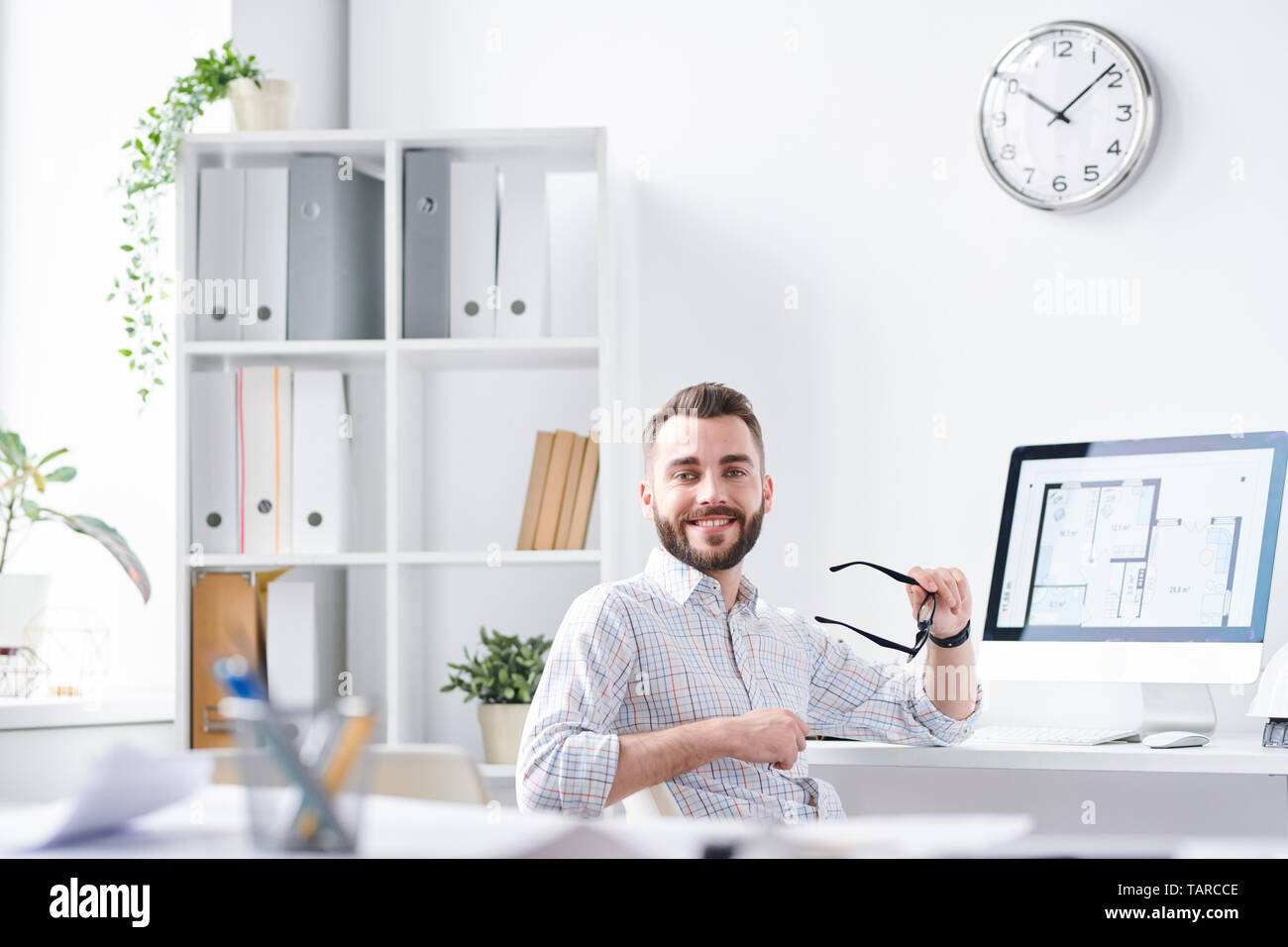Happy architect in office Stock Photo - Alamy