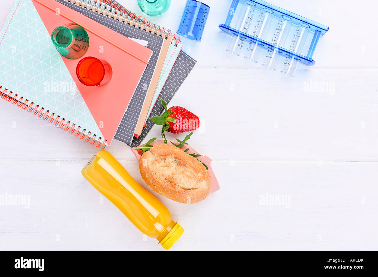 School lunch on a white wooden table. Top view. Lunch for the student ...