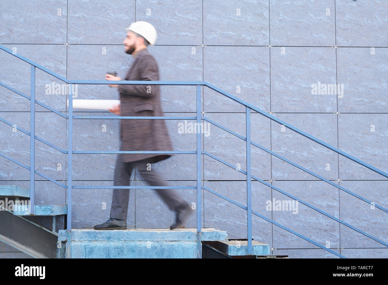Walking along wall Stock Photo - Alamy