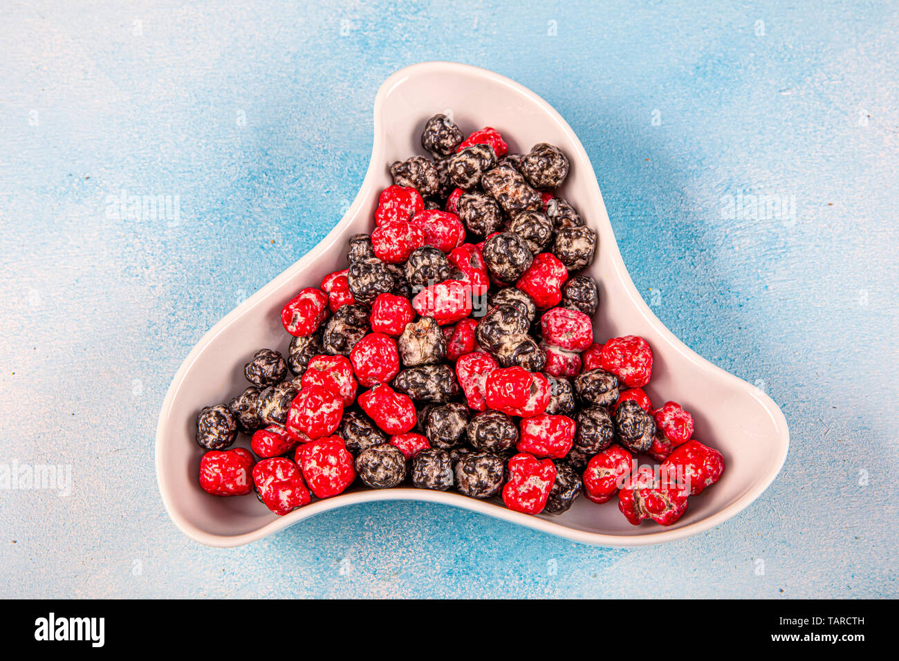 Colorful chocolates and candies on the wooden floor Stock Photo - Alamy