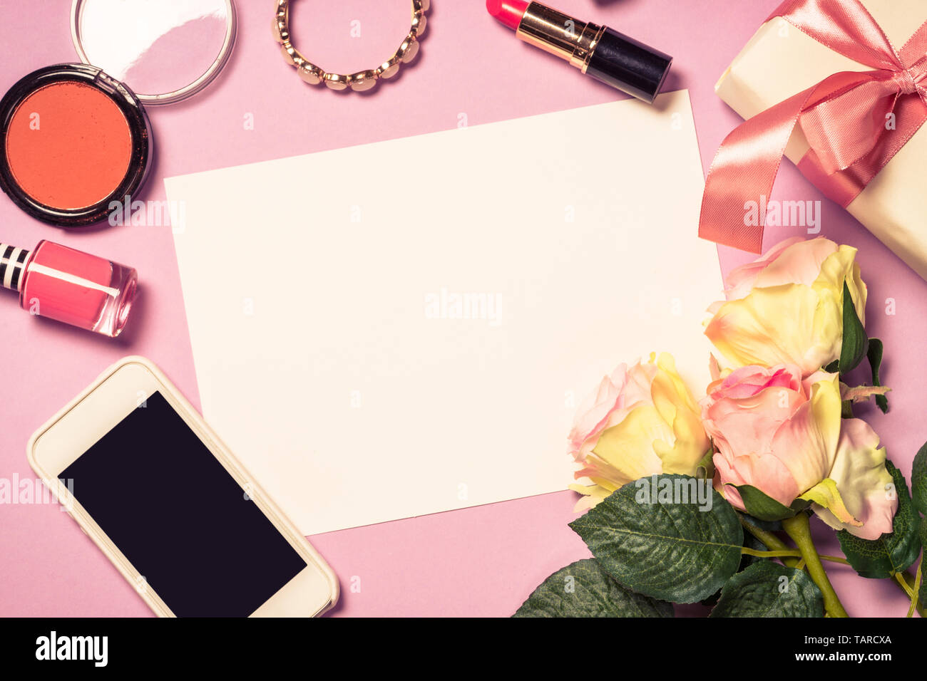 Makeup professional cosmetics on purple background Stock Photo - Alamy