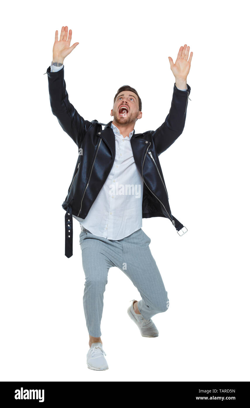 front view man protects hands from what is falling from above. Man ...