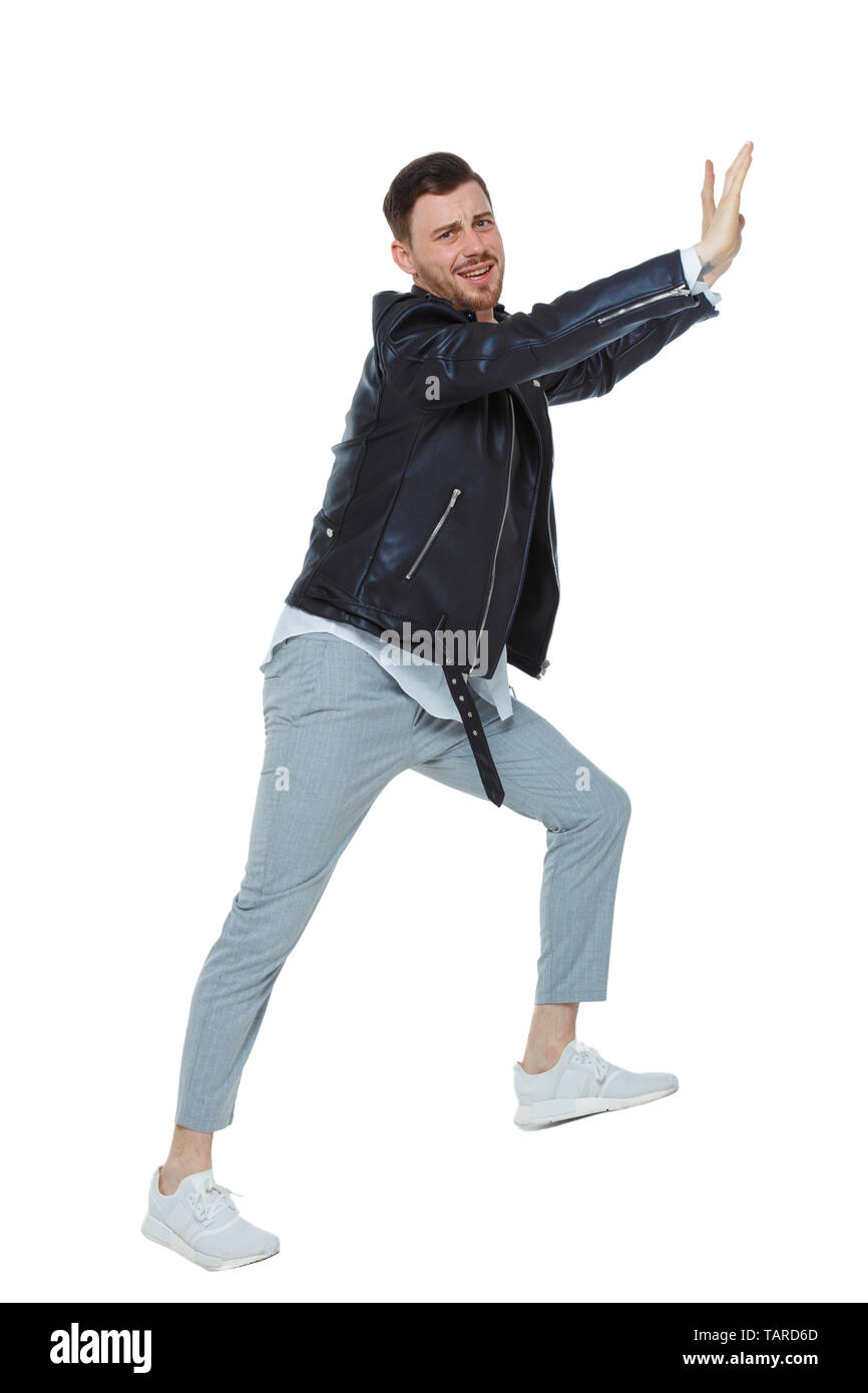 back view of man pushes wall. Isolated over white background. Rear view ...