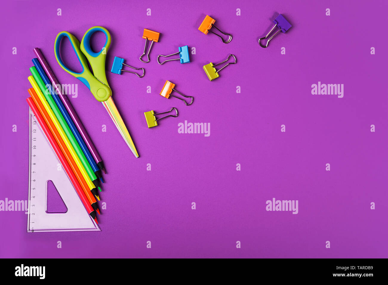 Back to school background with pencils, square ruler, scissors, paper ...