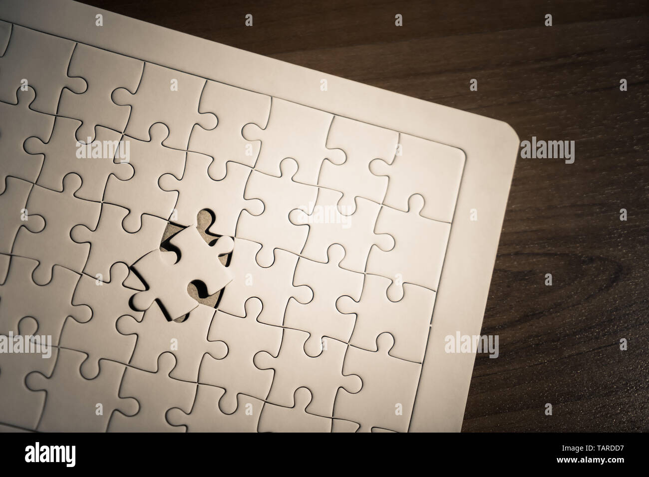 placing the last jigsaw for business solution concept Stock Photo - Alamy