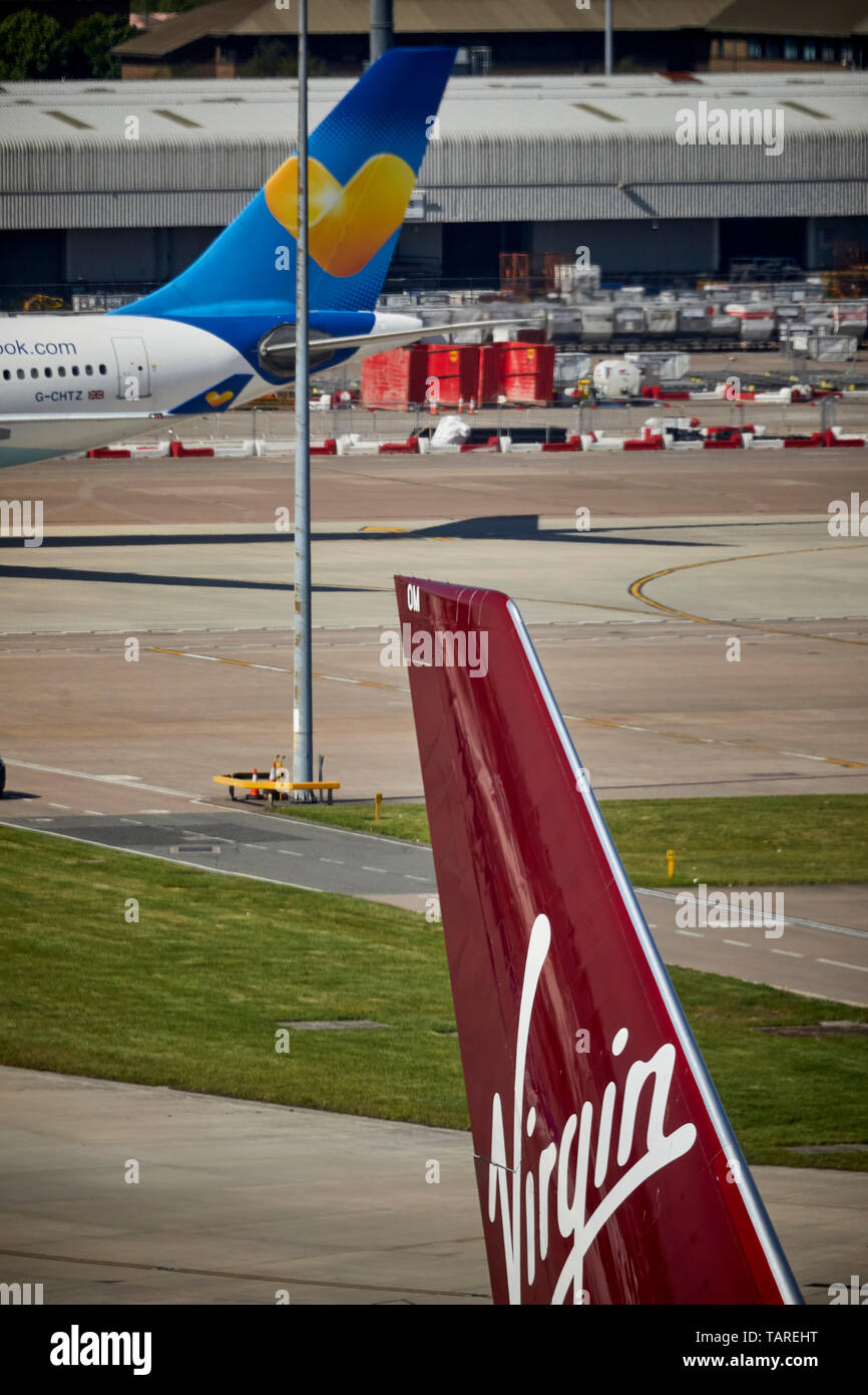 MANCHESTER AIRPORT terminal 2 Virgin tail and a Thomas Cook tail ...