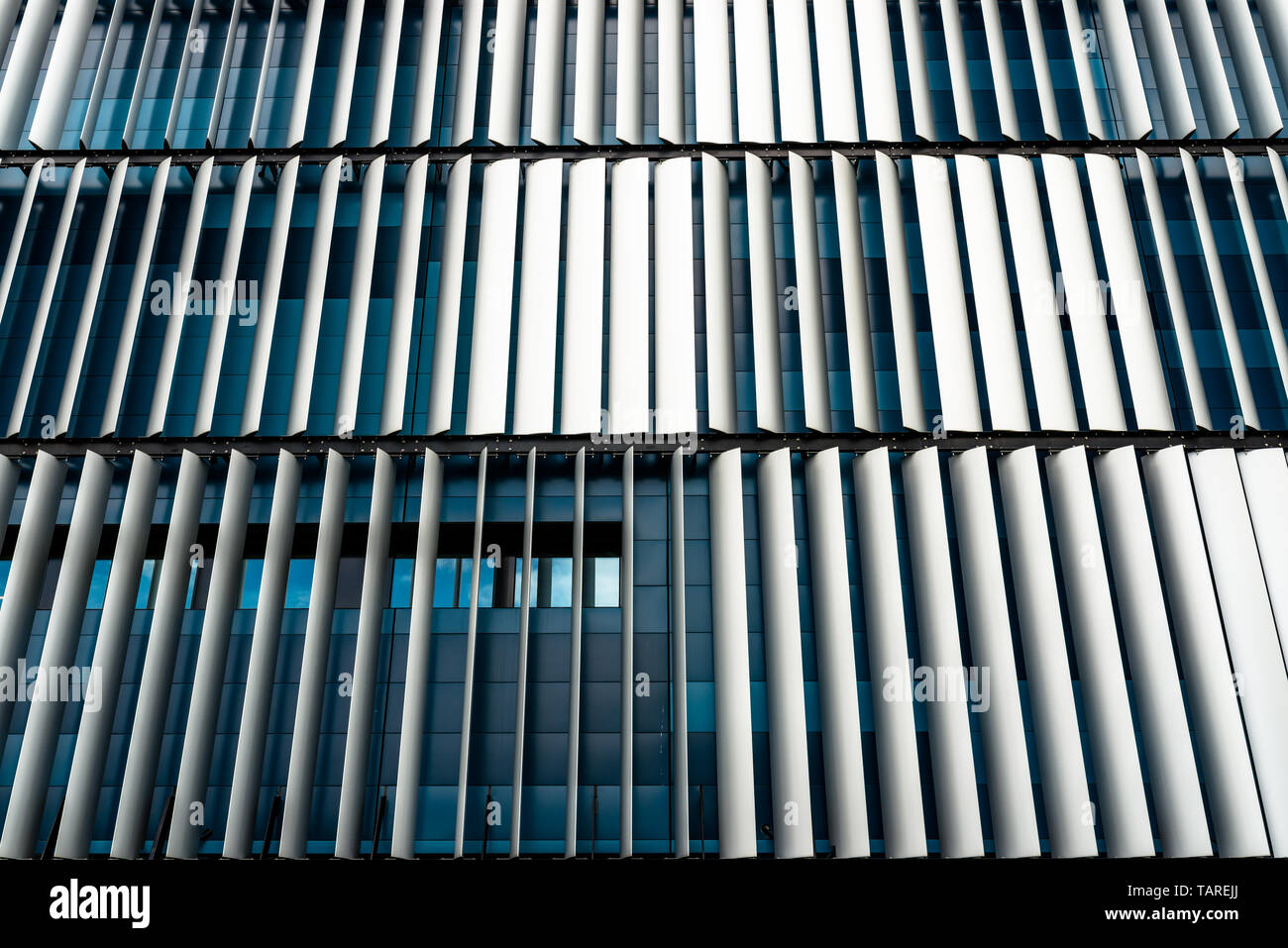 The facade of a modern building with an innovative facade made of ...
