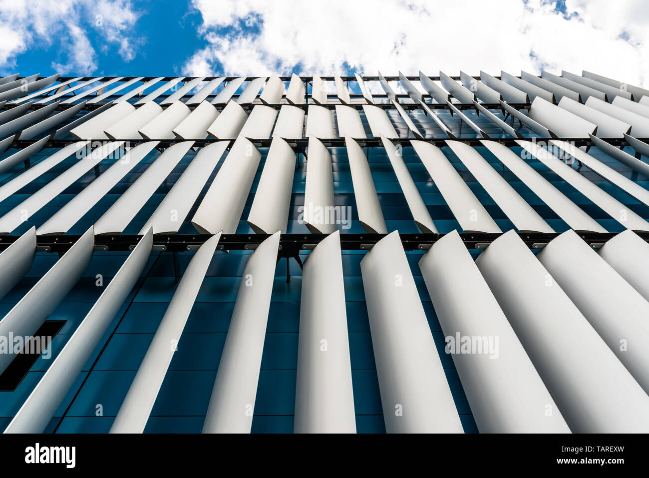 The facade of a modern building with an innovative facade made of ...