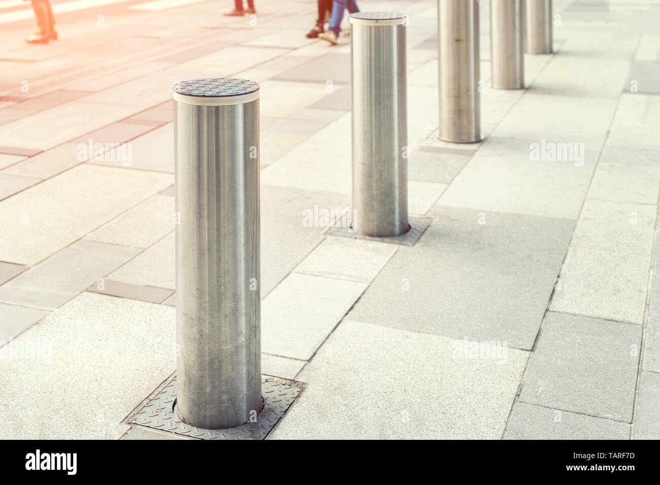 Stainless steel bollard entering pedestrian area on Vienna city street ...