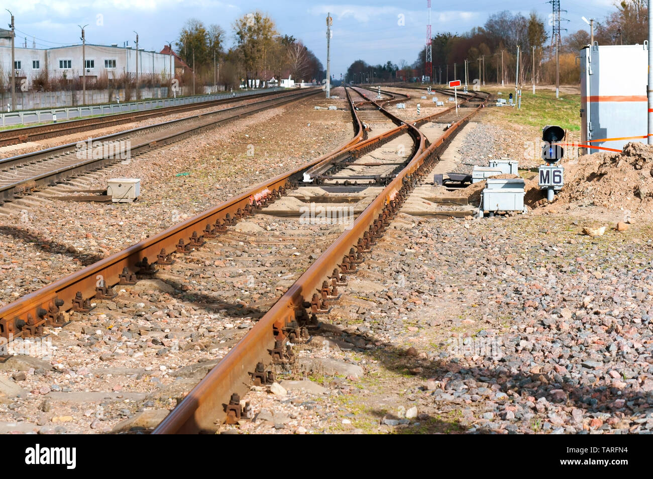 railway stretching into the distance, rails in three rows Stock Photo ...