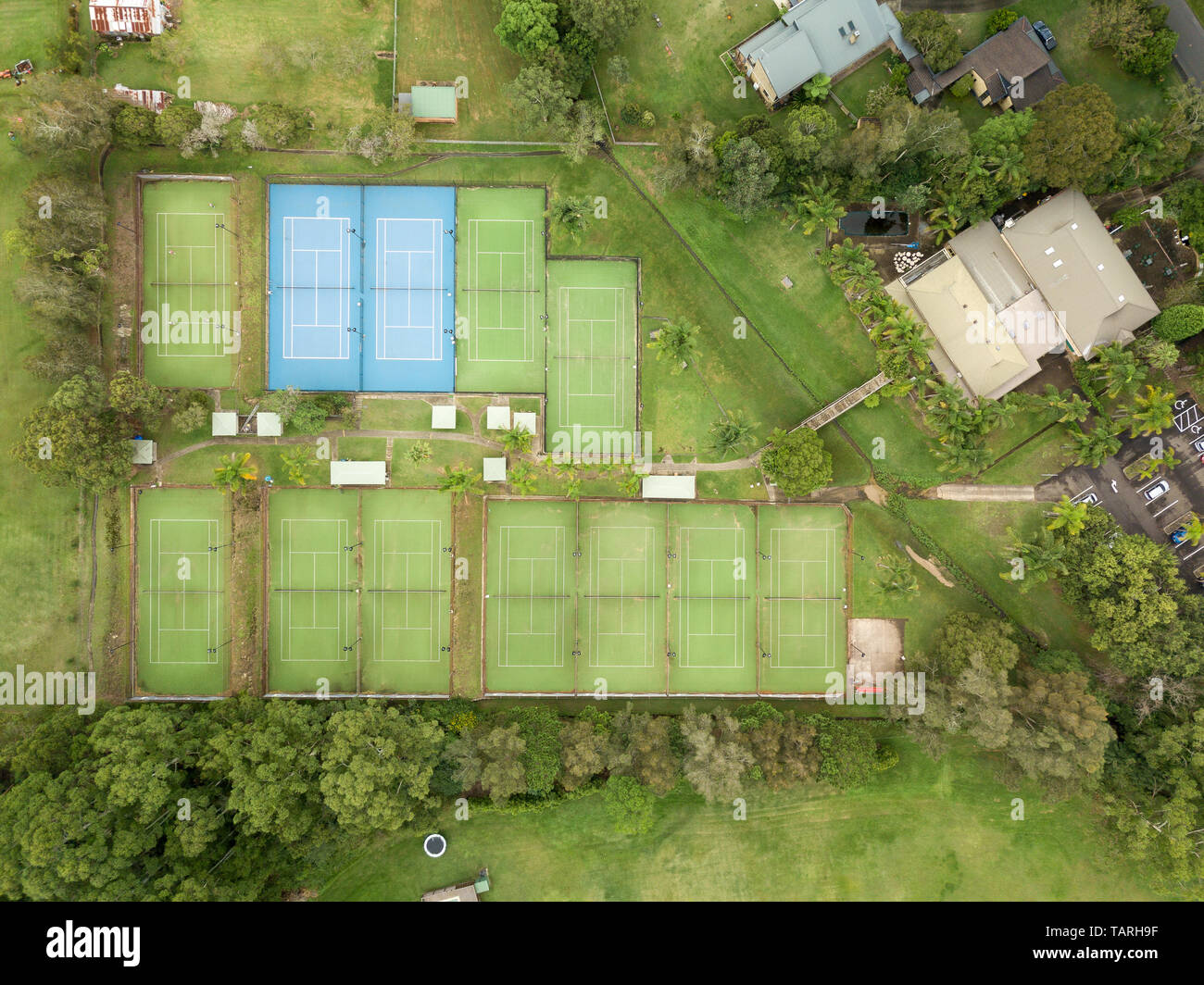 Aerial top down view of tennis center and facility with blue hard ...