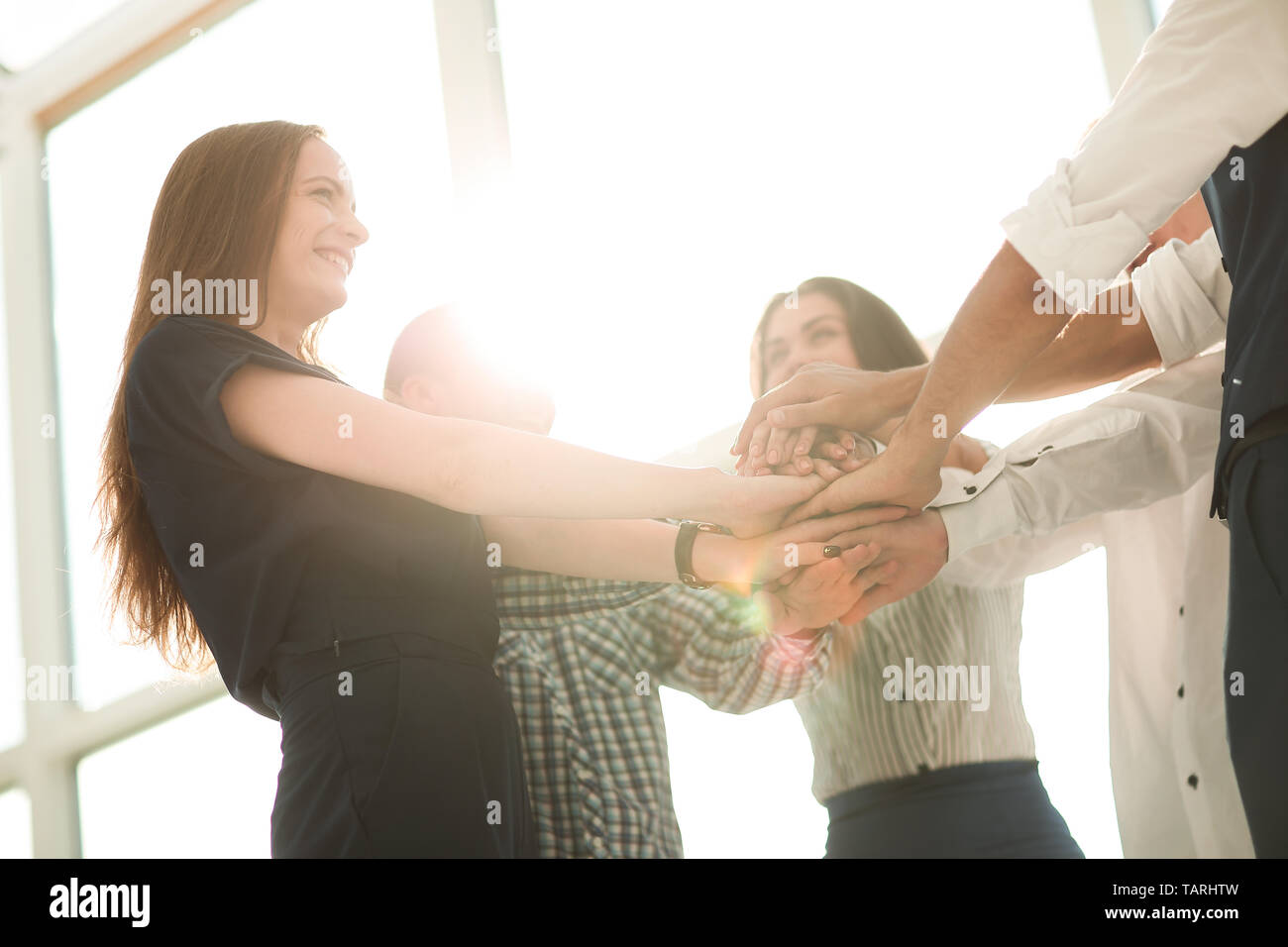 Close-Up of hands business team showing unity with putting their hands togethe. concept of ...