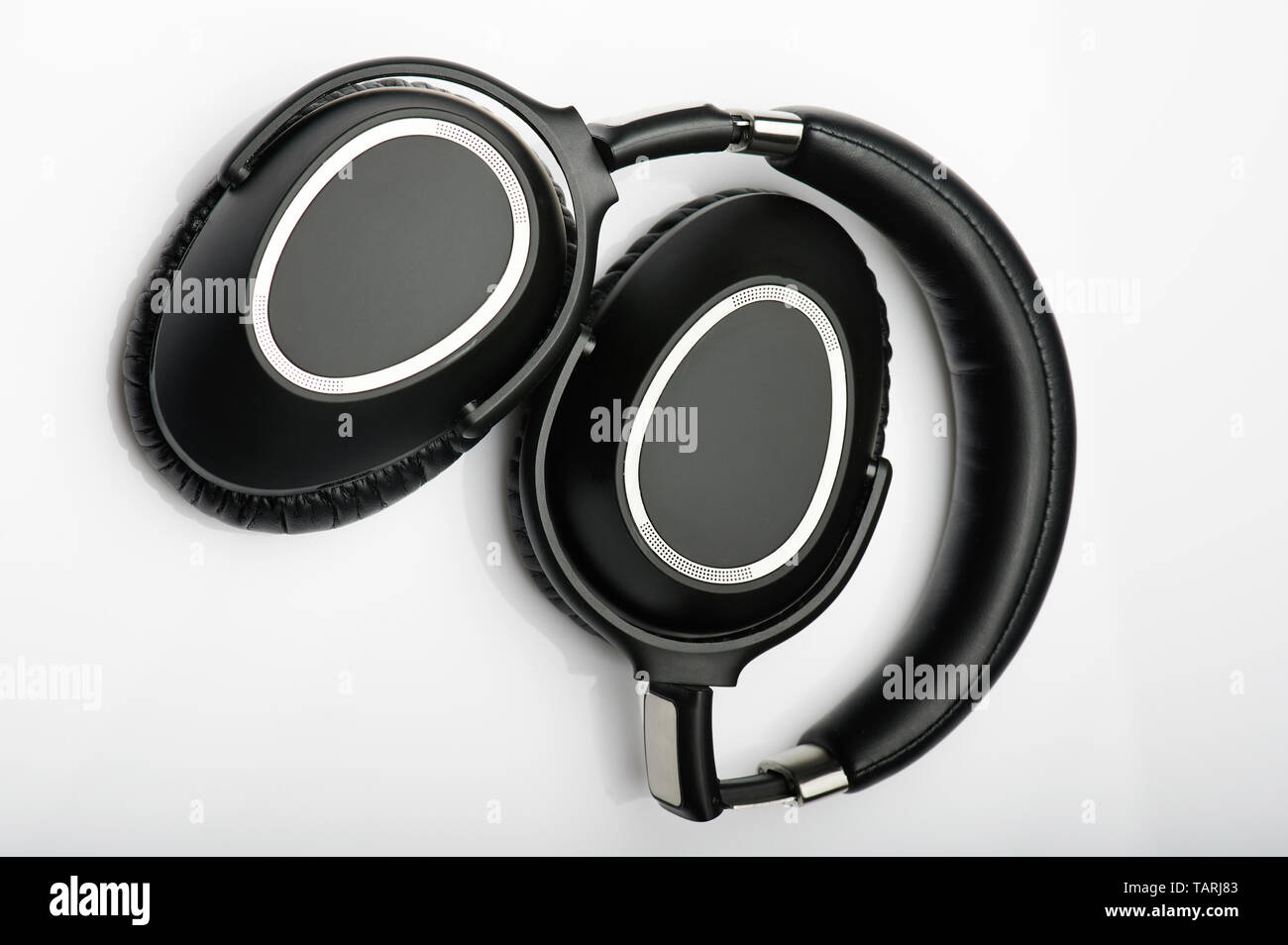 Foldable black leather headphones above top view isolated Stock Photo ...