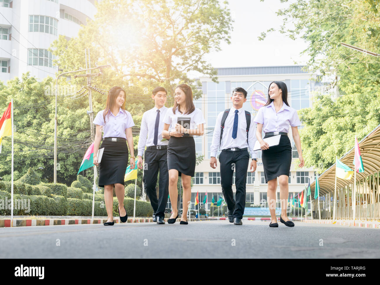 Happy and smart student walking on road at university, Education and ...