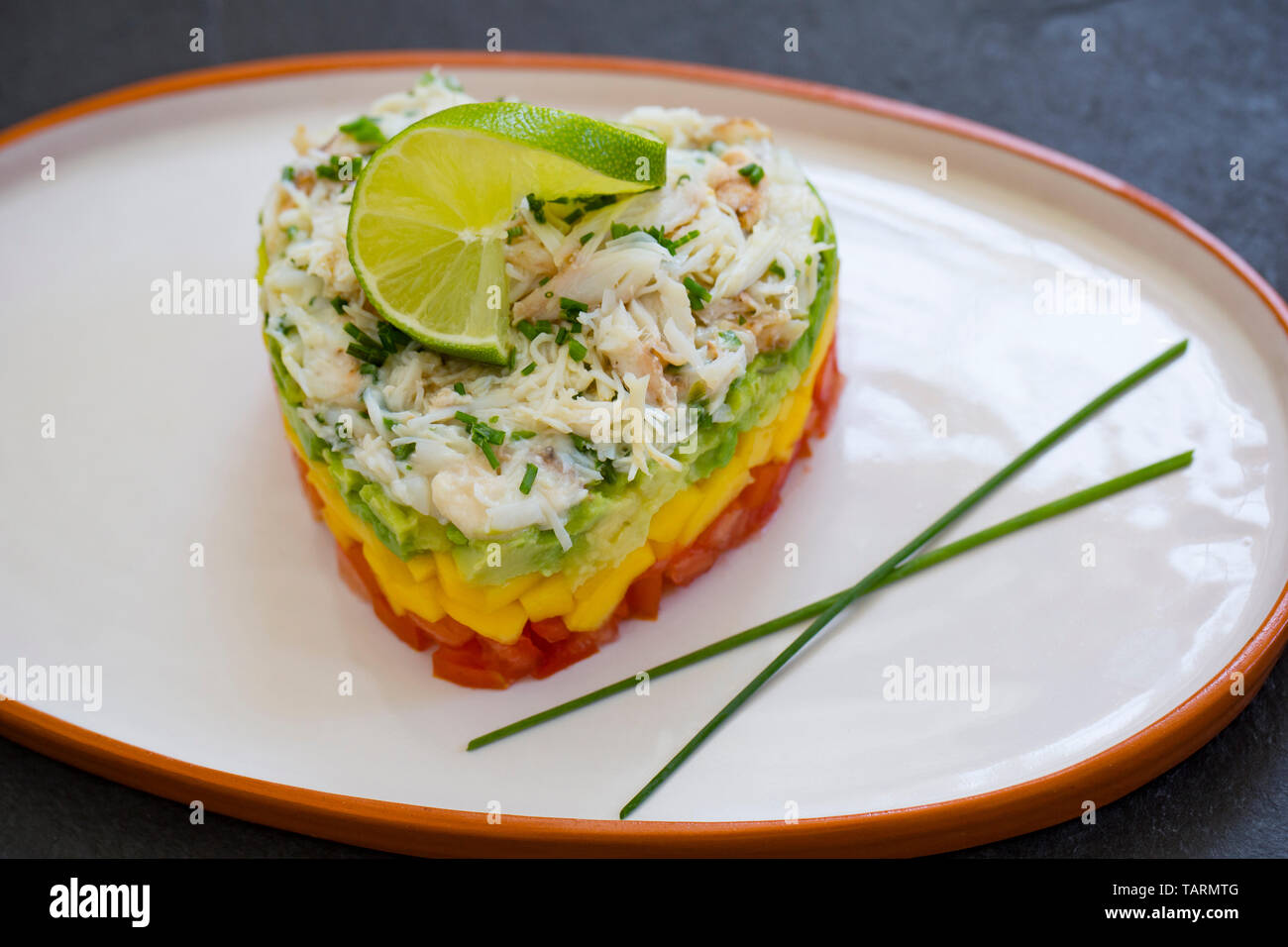 A homemade spider crab meat stack made in a heart-shaped mould ...