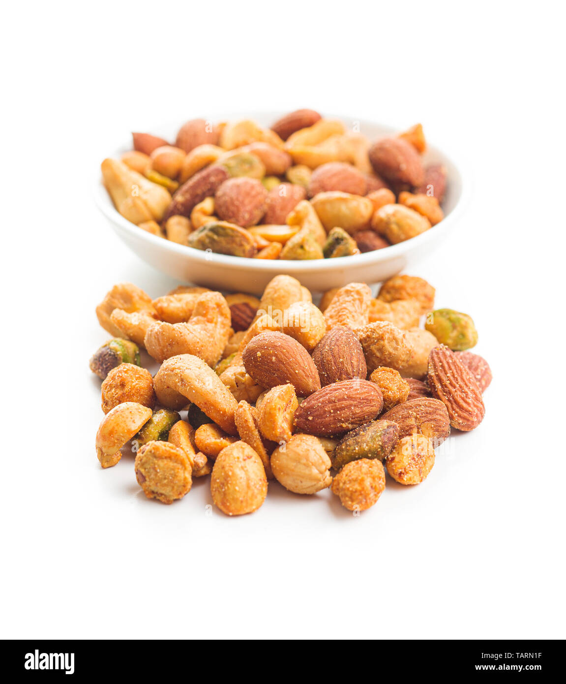 Spicy flavoured nuts. Mix of nuts isolated on white background Stock ...