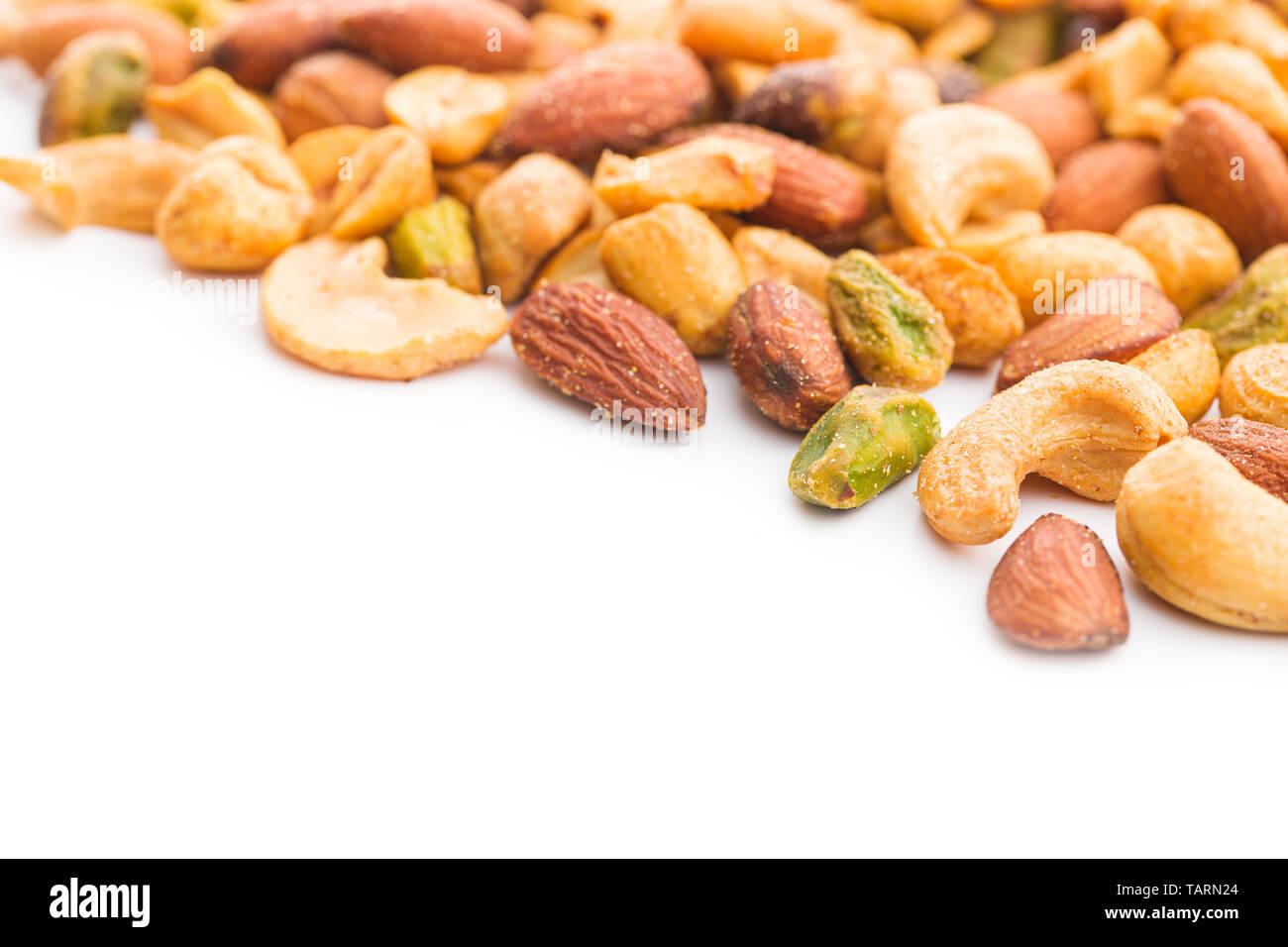 Spicy flavoured nuts. Mix of nuts isolated on white background Stock ...