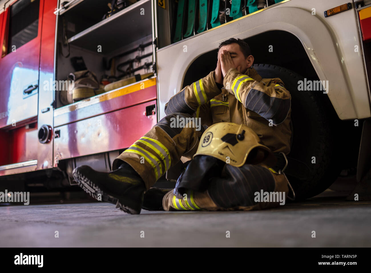 Tired fireman hi-res stock photography and images - Alamy
