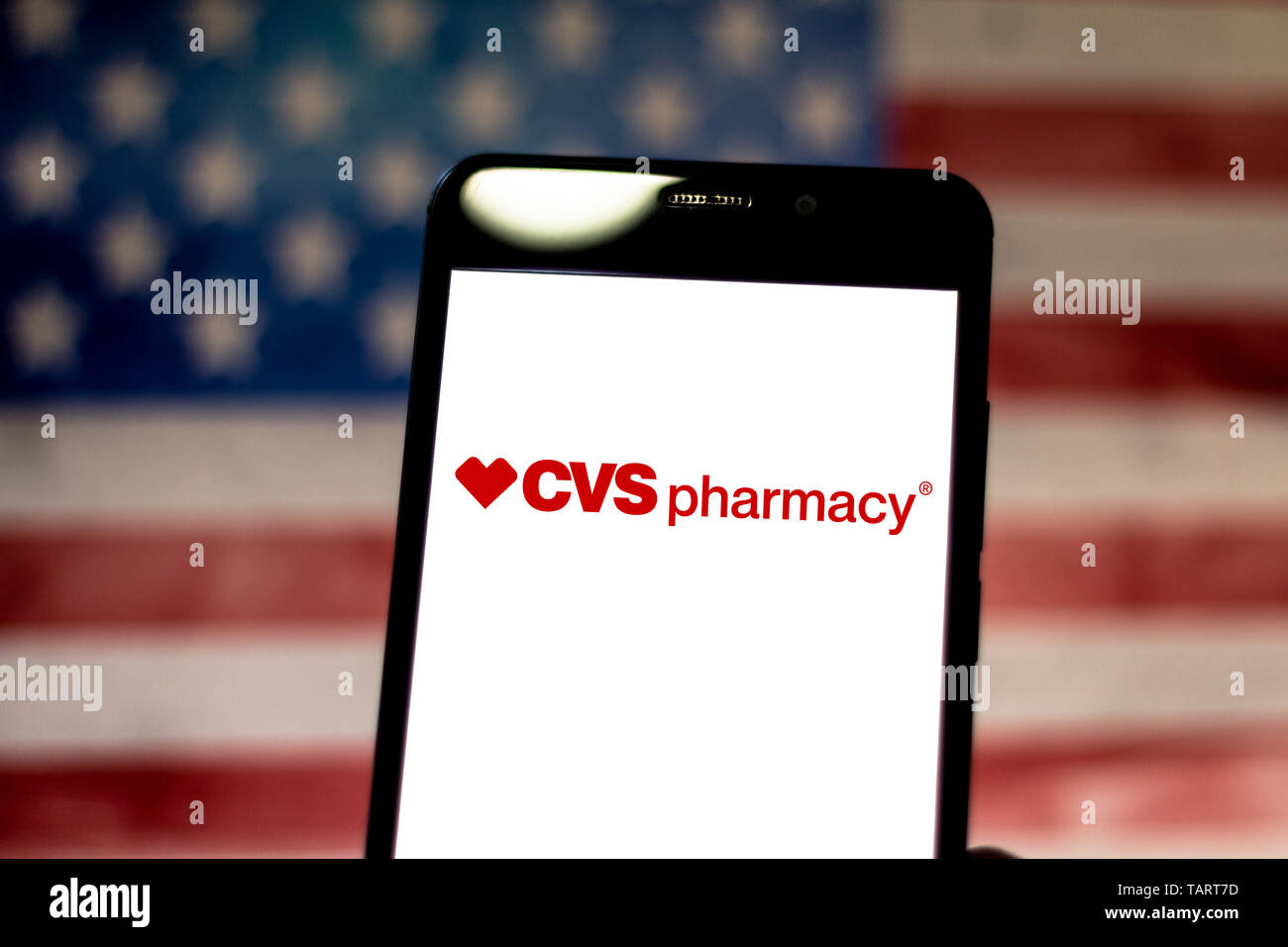 In this photo illustration the CVS Pharmacy logo is displayed on a ...