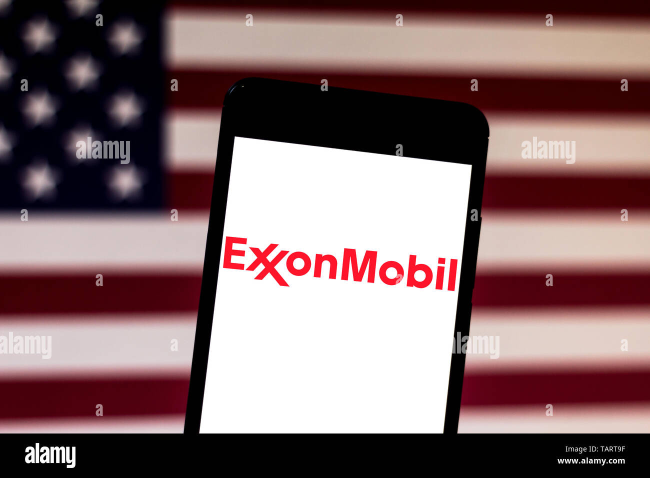 In this photo illustration the Exxon Mobil Corporation logo is seen ...