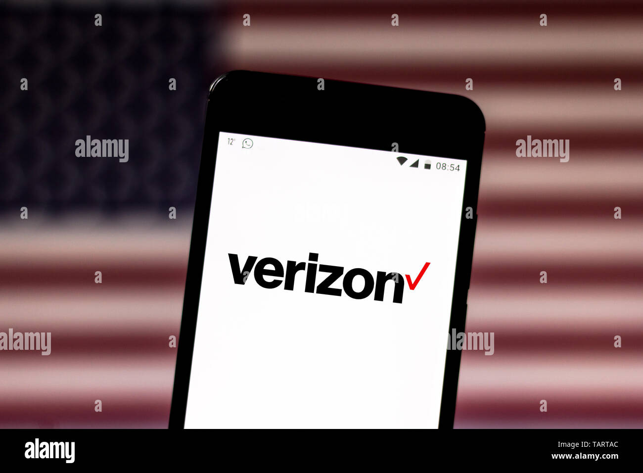 In this photo illustration the Verizon Wireless logo is seen displayed ...