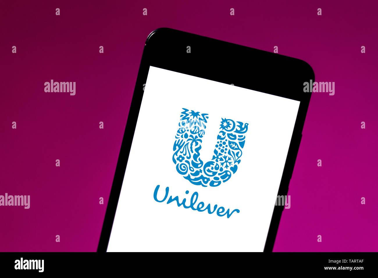In this photo illustration the Unilever logo is seen displayed on a ...