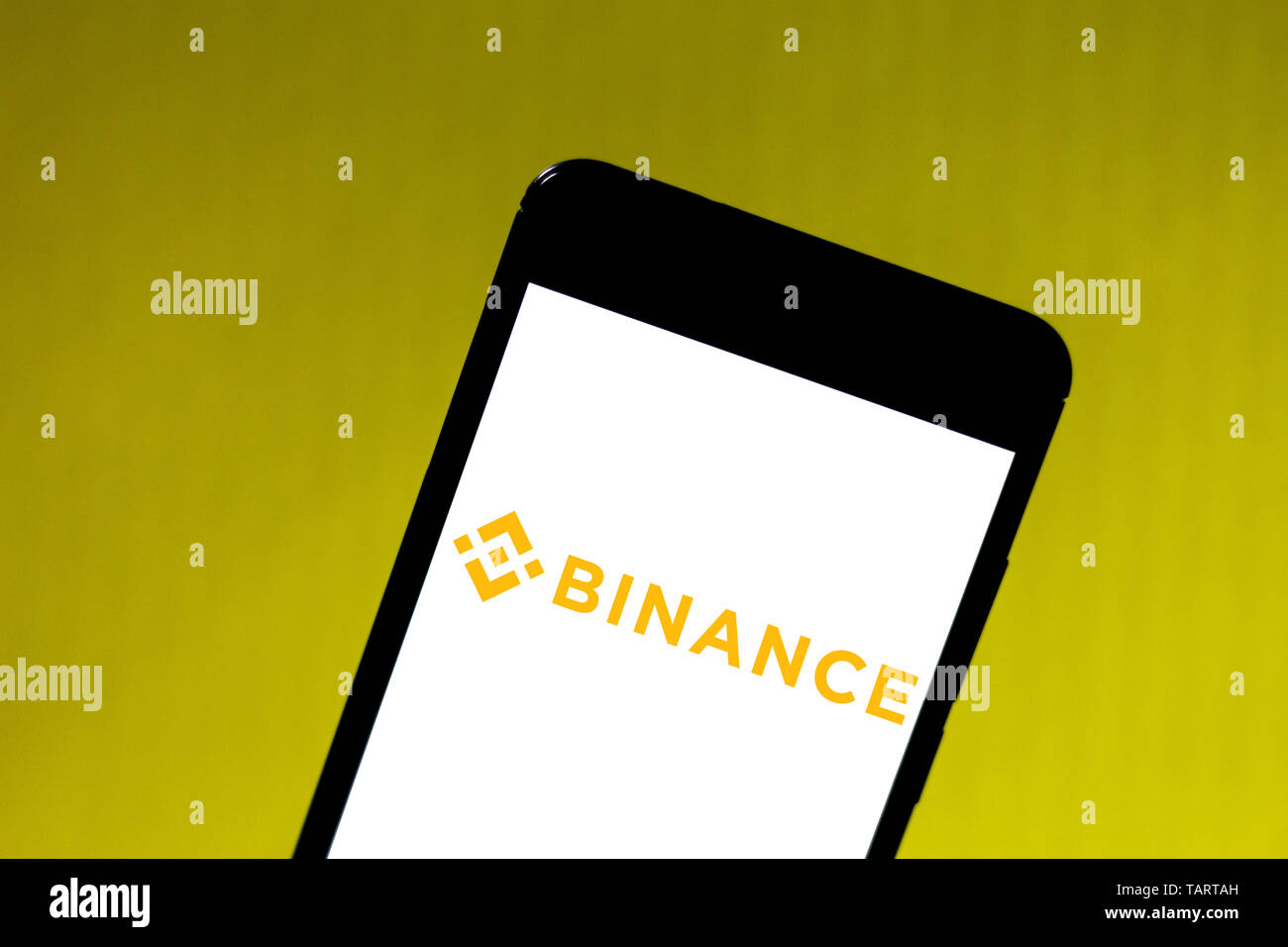 In this photo illustration the Binance logo is seen displayed on a ...
