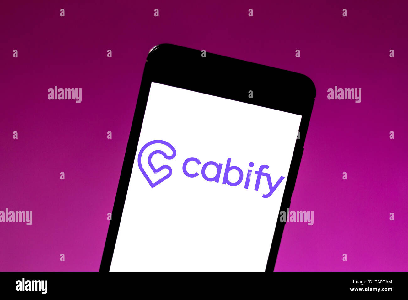 In this photo illustration the Cabify logo is seen displayed on a ...