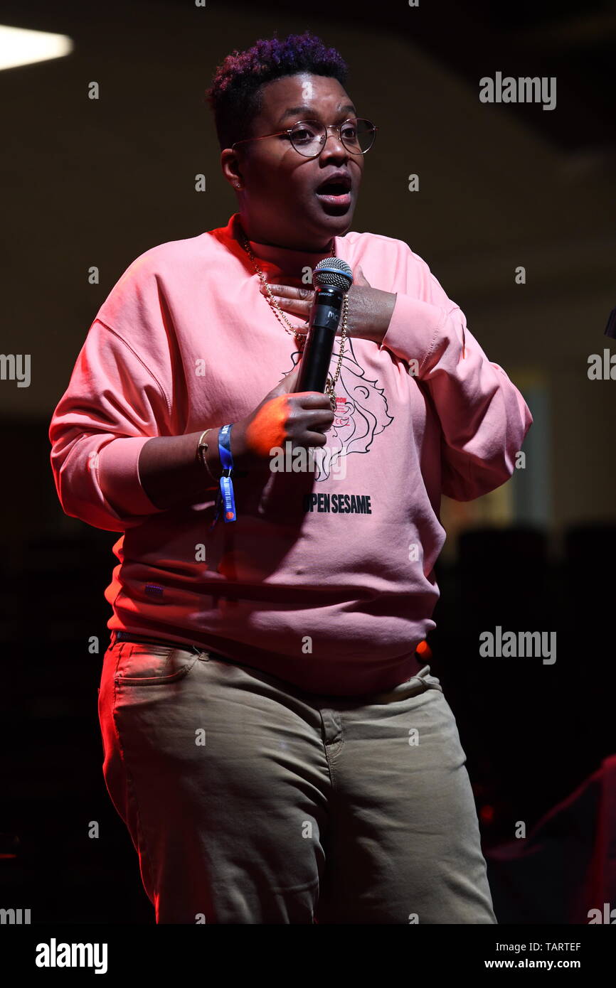 Comedian Sam Jay is shown performing on stage during a "live" stand up ...