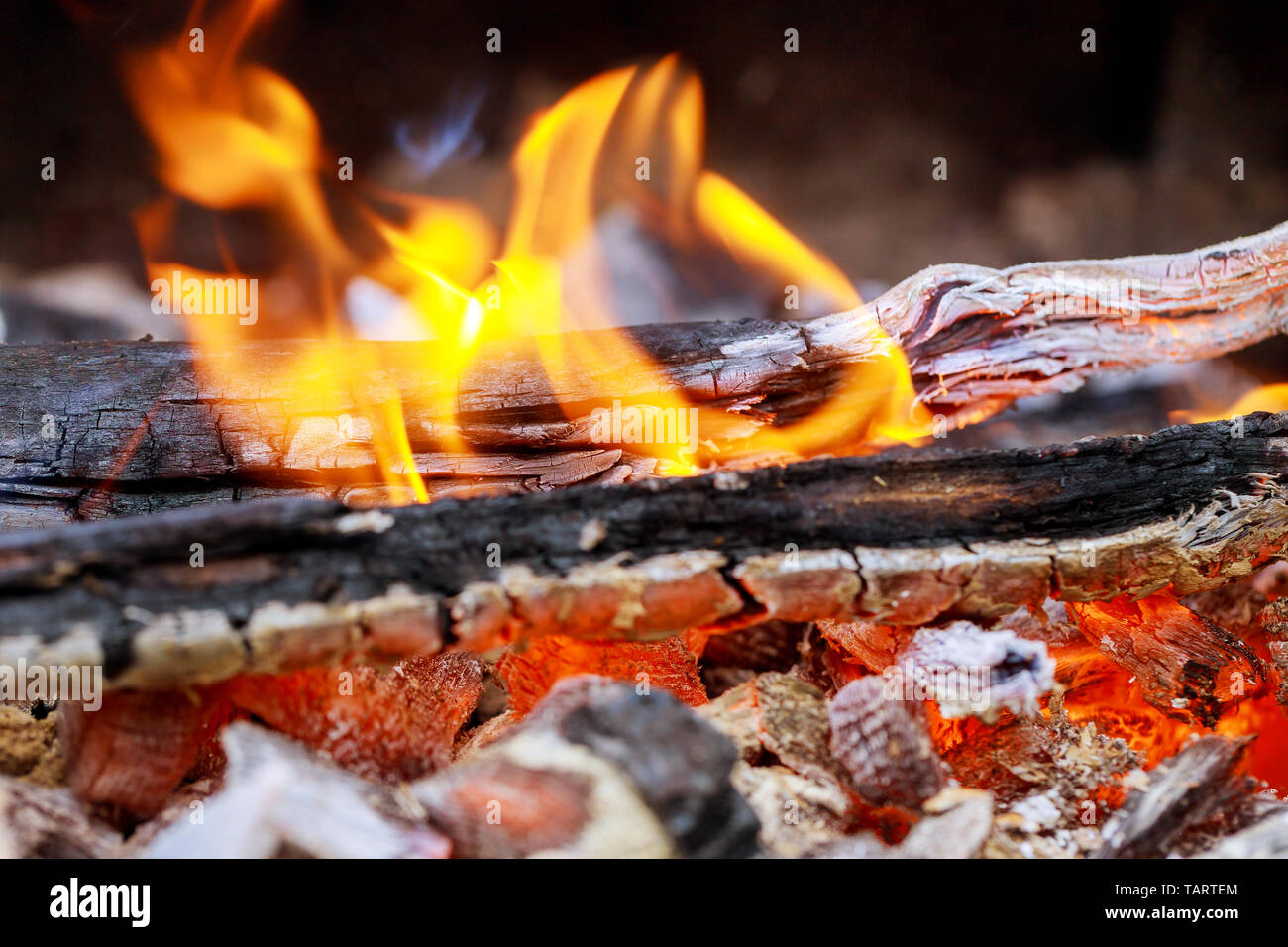 Preparation of fire for burning charcoal on barbecue grill Stock Photo ...