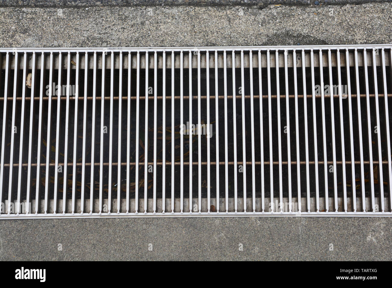 The drain cover, metal street water sewer cover Stock Photo - Alamy