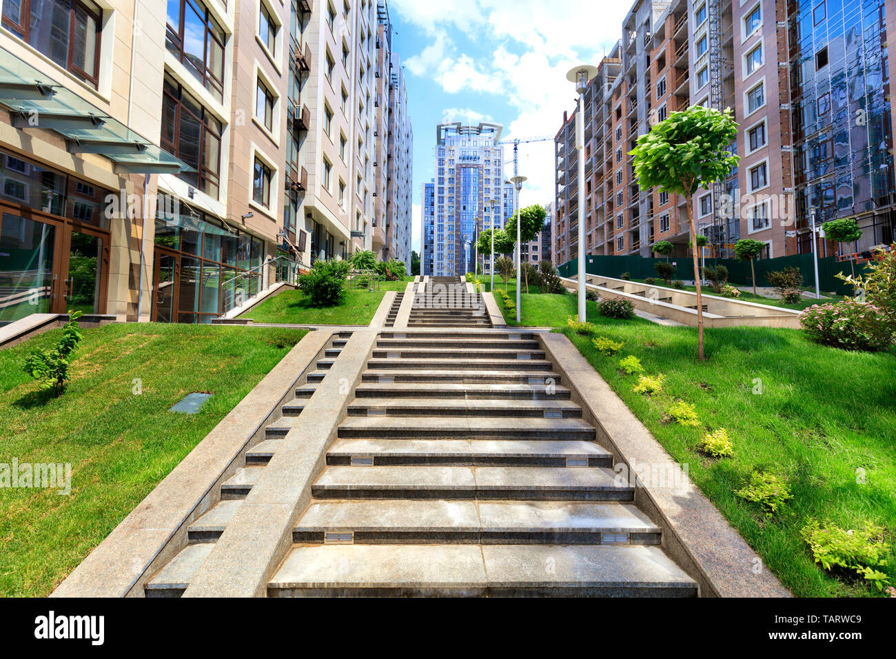The path goes up the stairs from the stone stairs of gray granite among ...