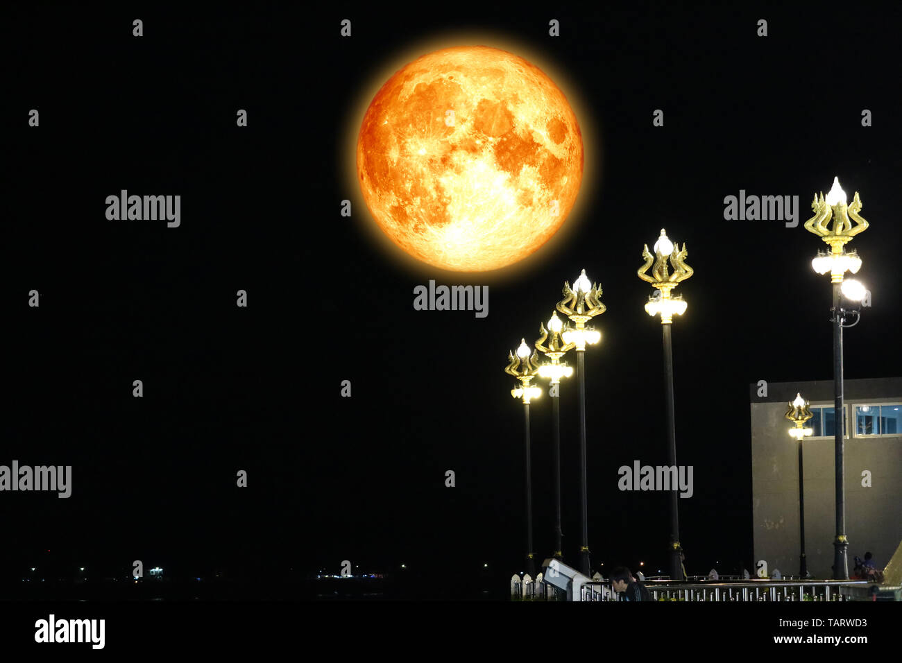 full blood moon on night sky and Naga light pole, Elements of this ...