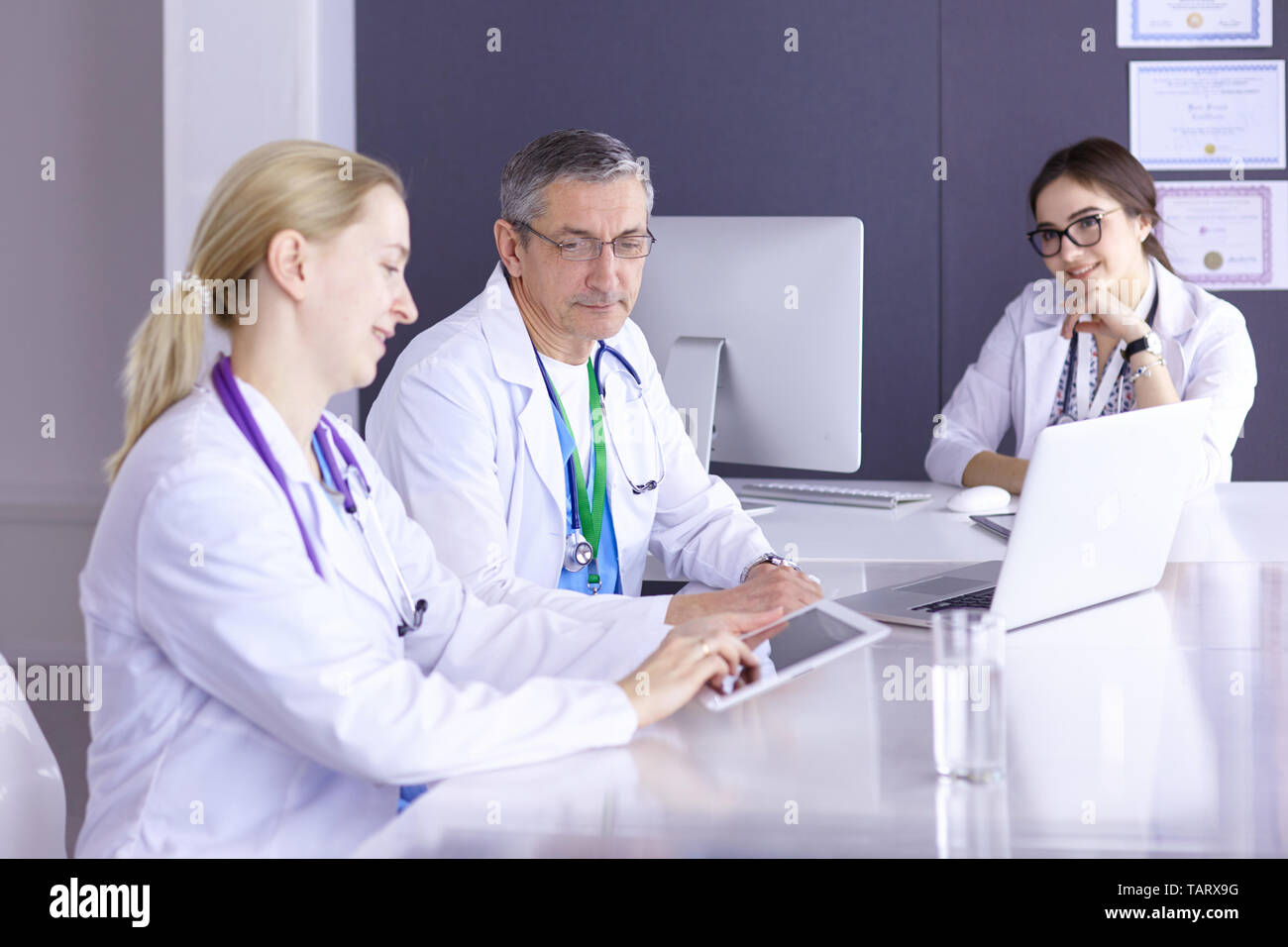 Doctors having a medical discussion in a meeting room Stock Photo - Alamy