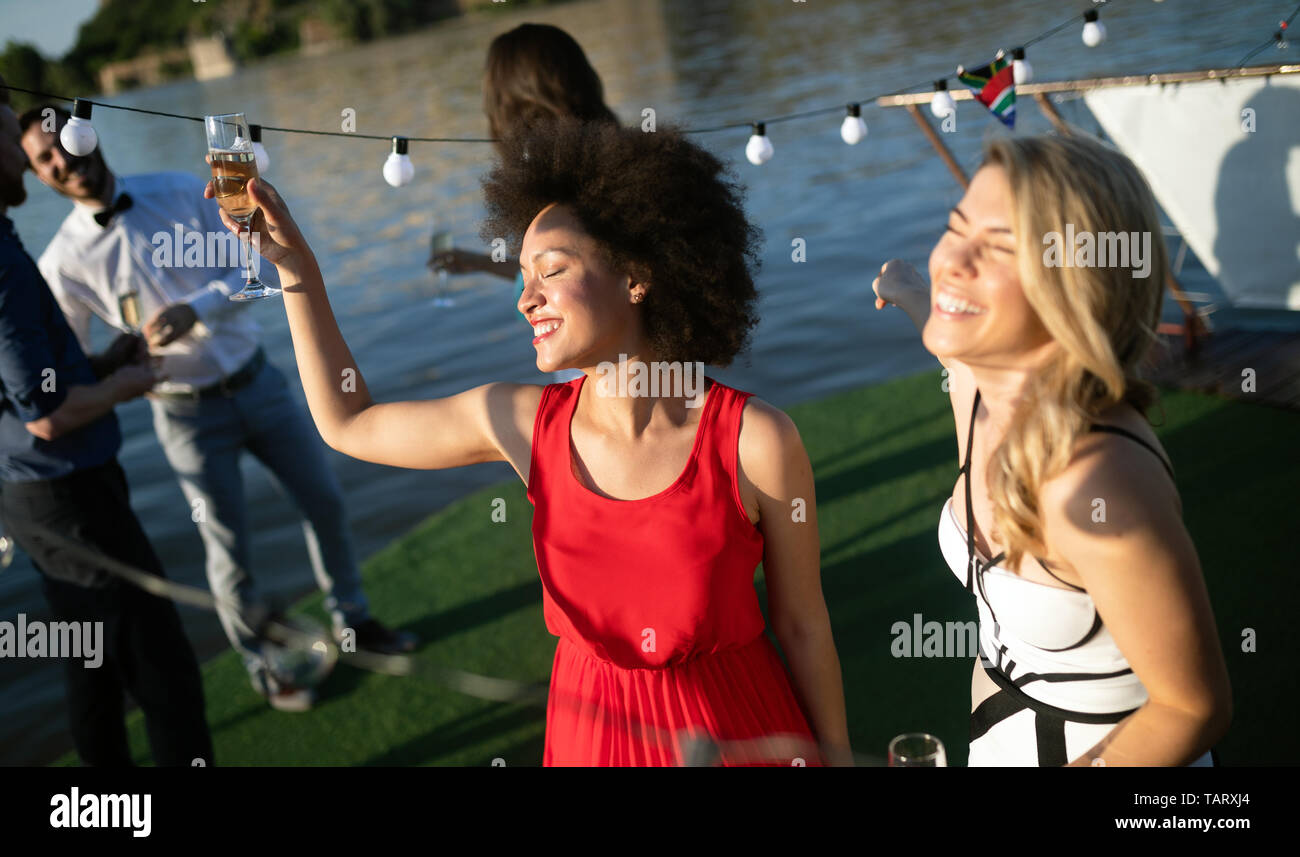 Group of friends at party dancing and smiling together Stock Photo - Alamy