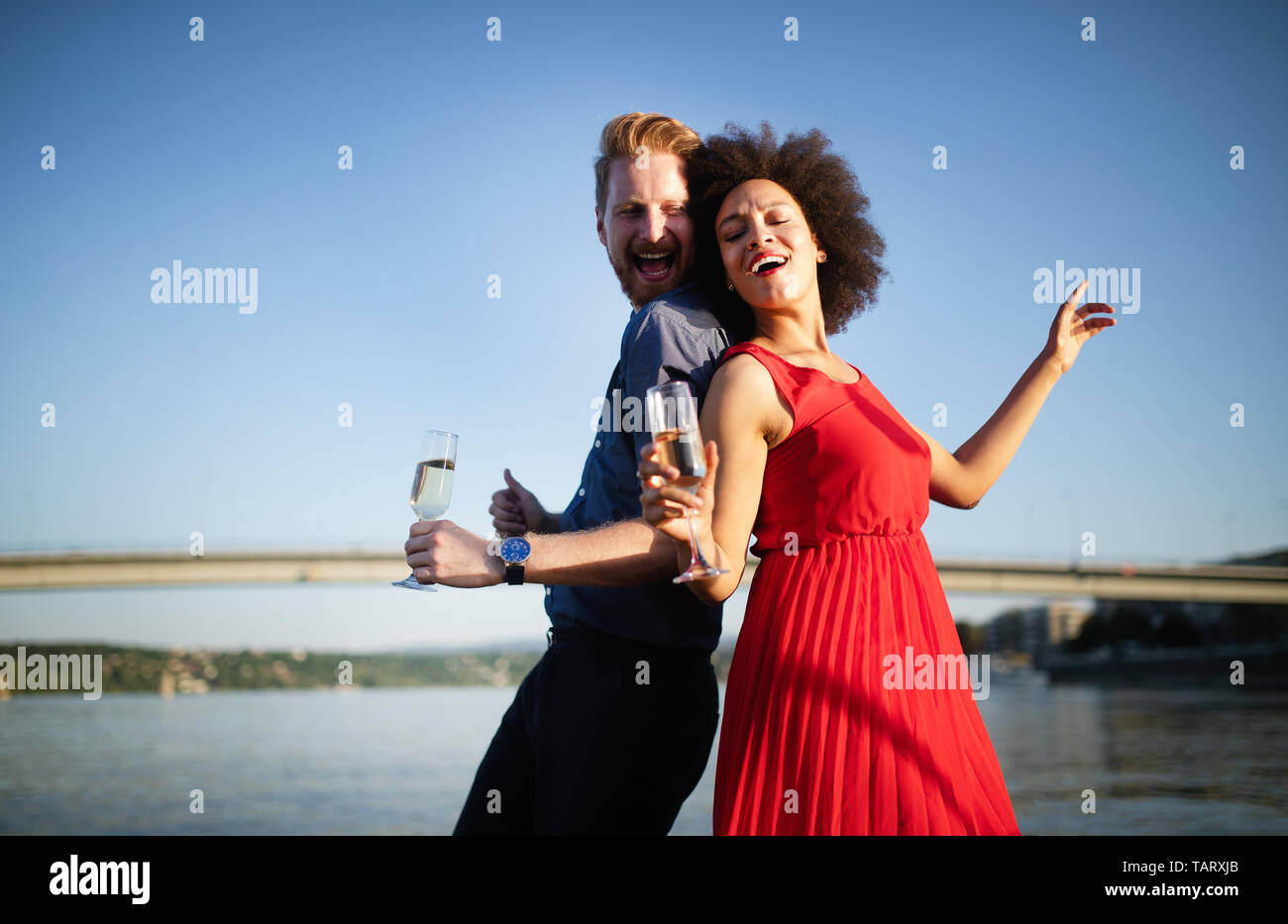 Happy smiling couple in love dancing and flirting Stock Photo - Alamy